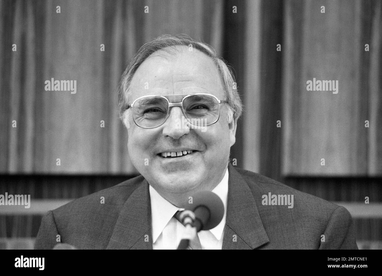 West German Chancellor Helmut Kohl smiles during his first news ...