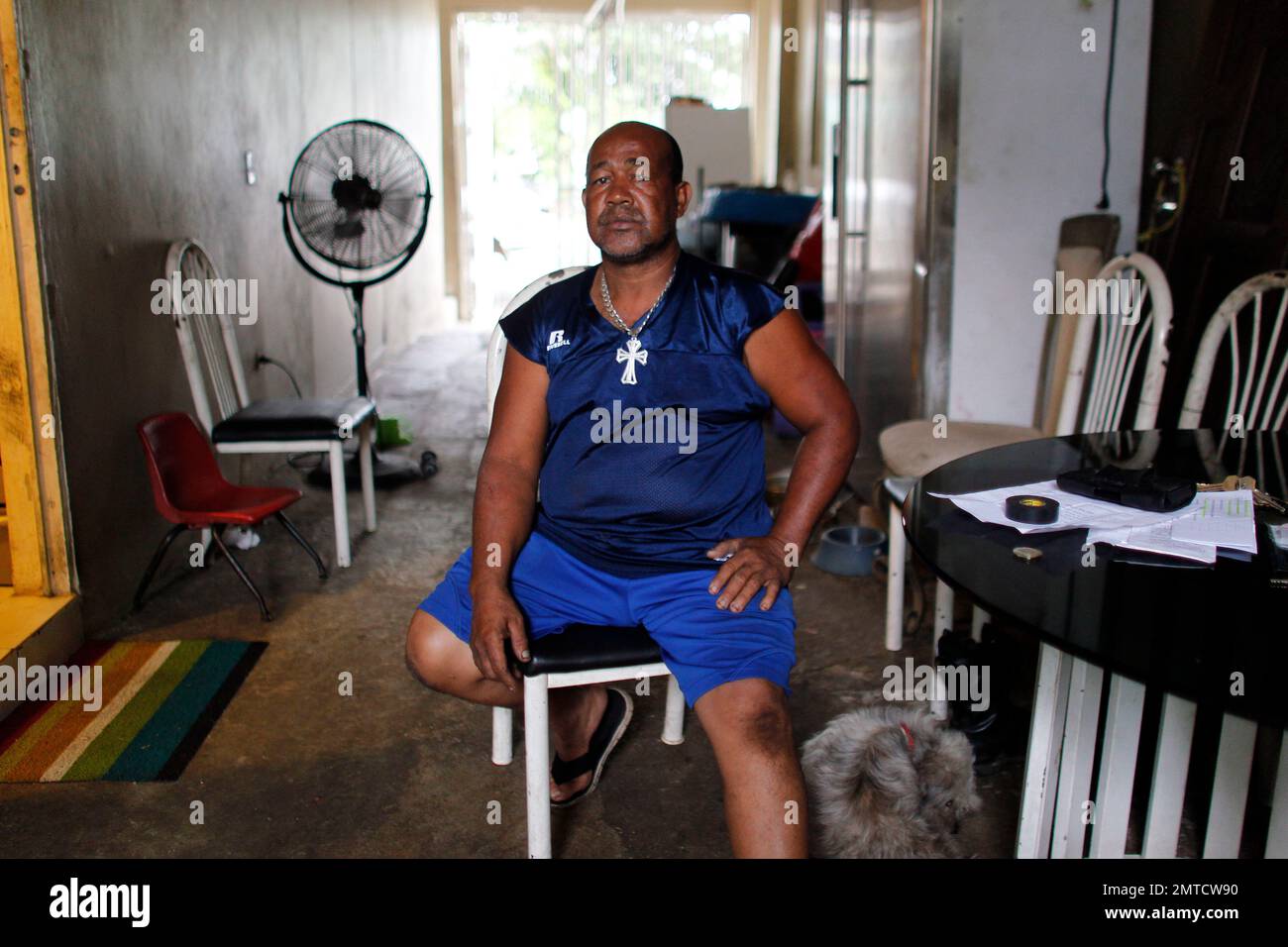 Elvis Guzman pose for a photo in his home in San Juan, Puerto Rico ...