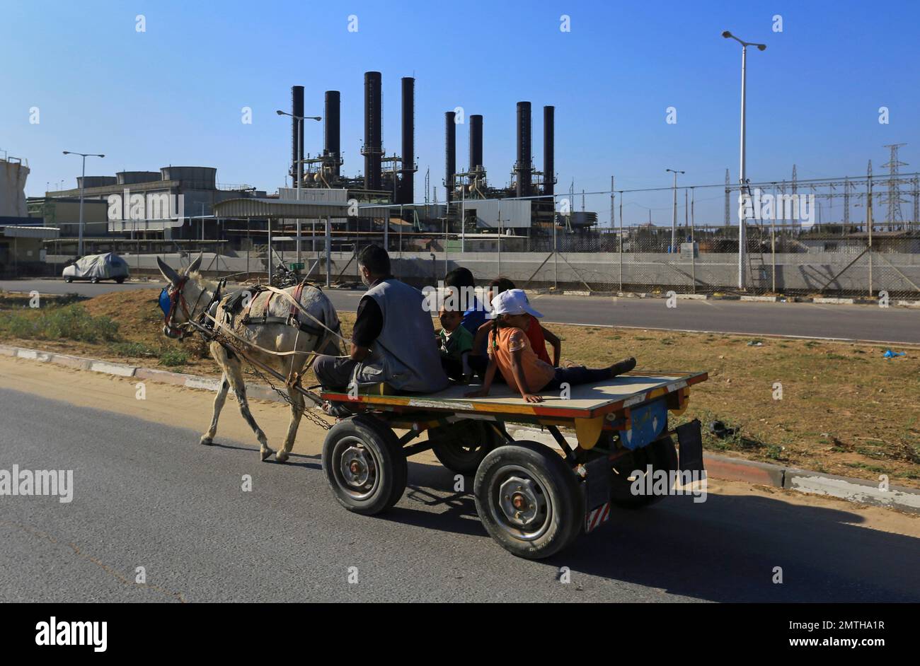 In this Sunday, June 4, 2017 photo, a father and his children ride ...