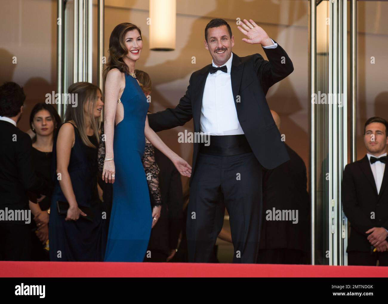 Adam Sandler, right, and his wife Jackie Sandler pose for photographers ...