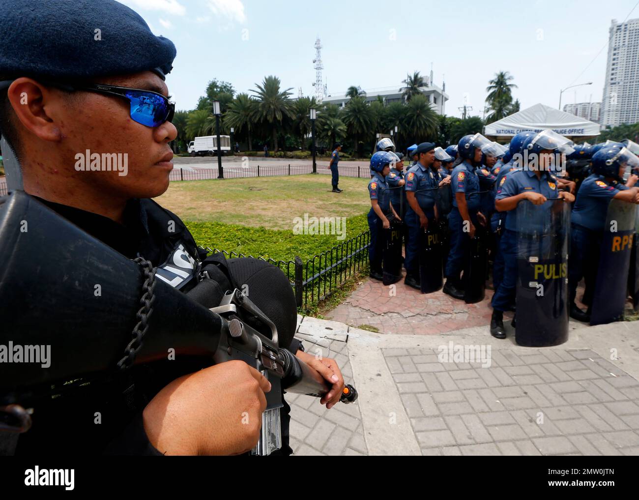 Philippine National Police SWAT officer guards near the entrance to the ...