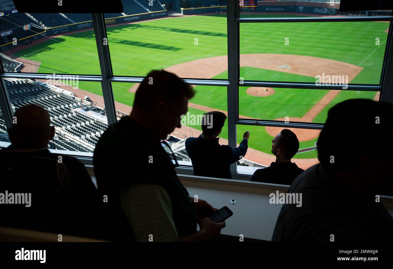 Members of the media tour the press box of SunTrust Park, the Atlanta ...
