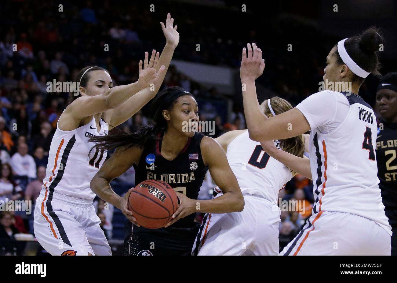 Florida State forward Ivey Slaughter, center, is triple- teamed by ...