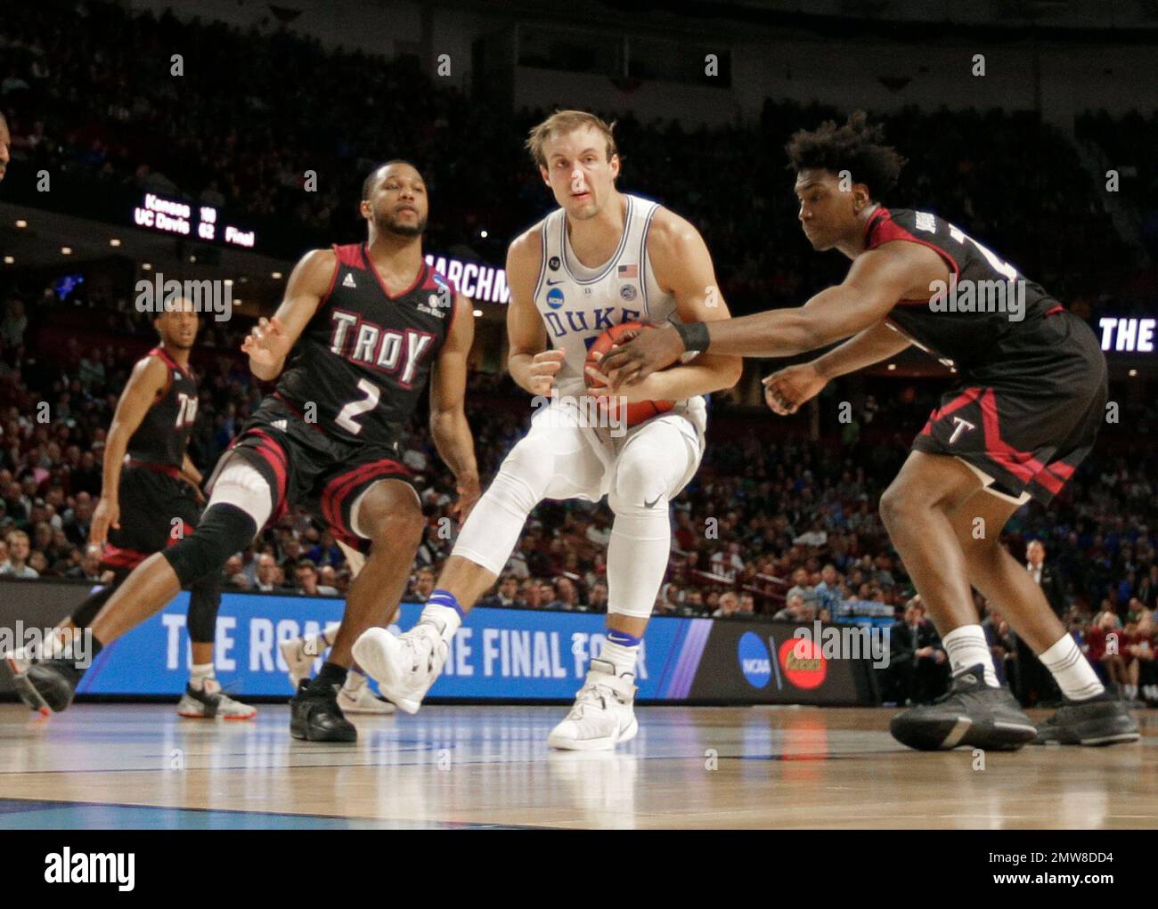 Duke's Luke Kennard, center, is fouled as he drives between Troy's ...