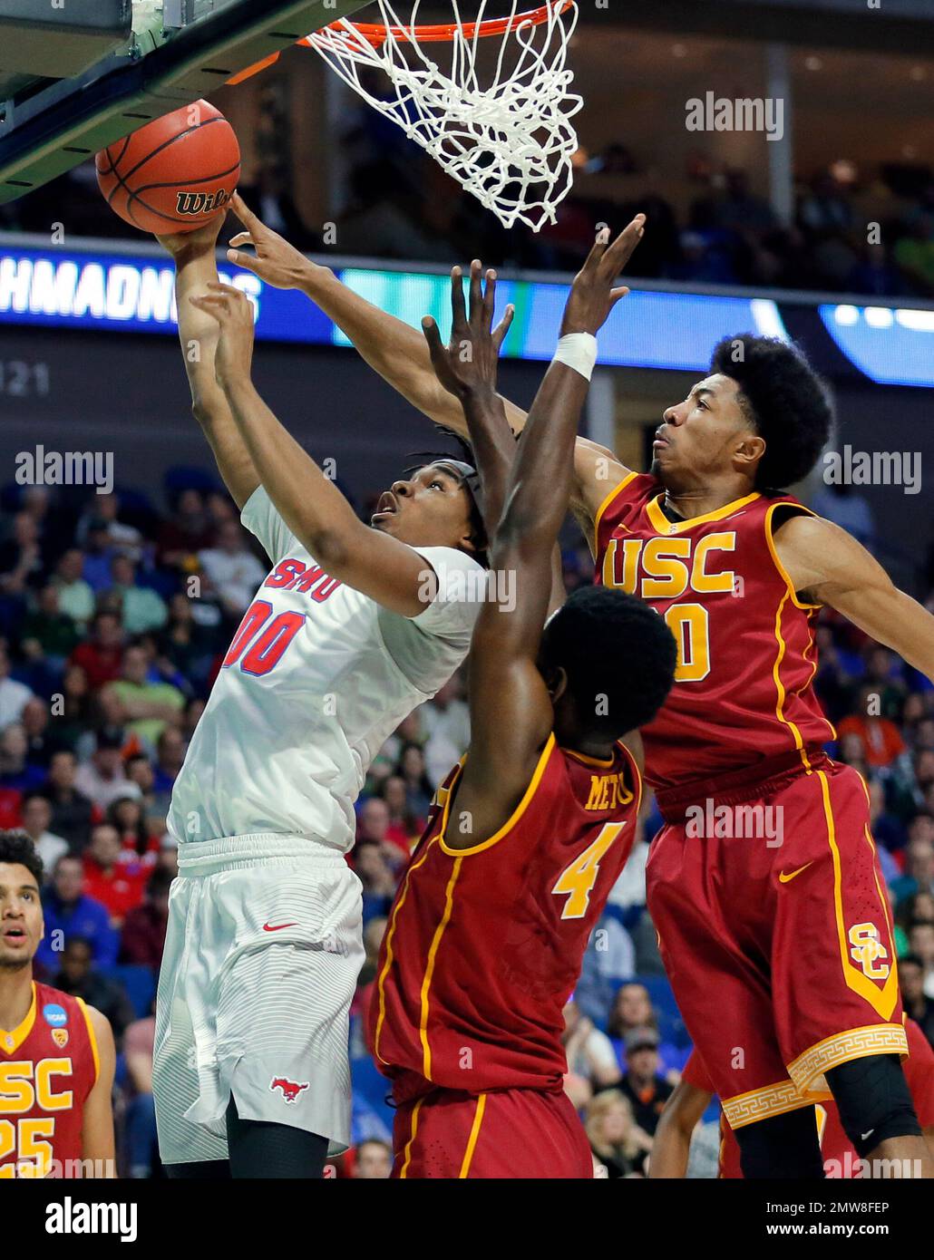 SMU's Ben Moore goes up for a shot as Southern California's Chimezie ...