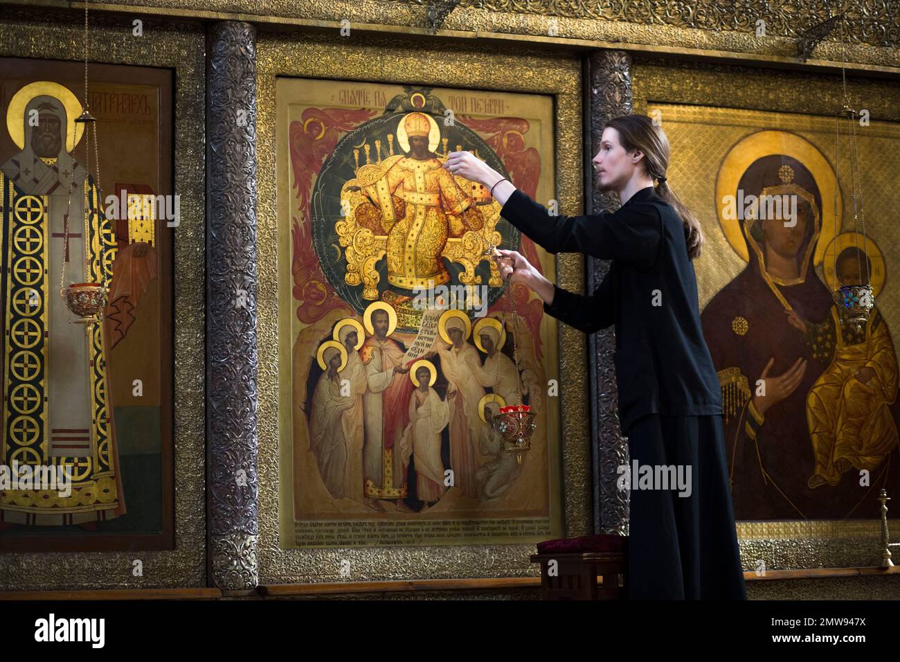 In this photo taken on Monday, March 13, 2017, an Orthodox priest hangs ...