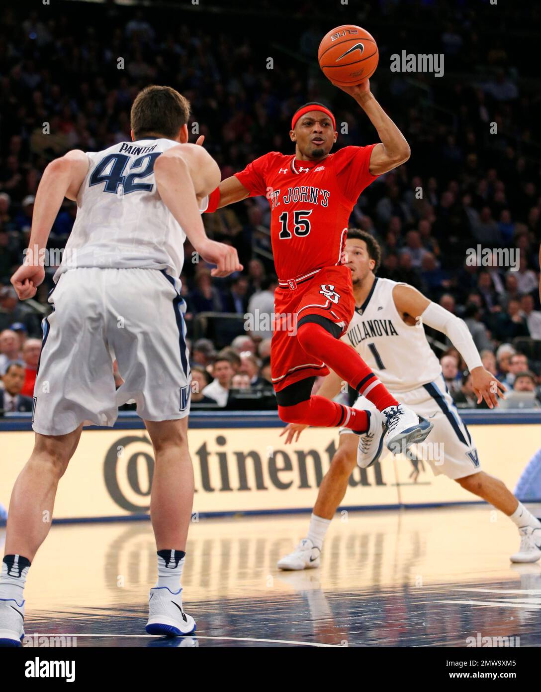 St. John's guard Marcus LoVett (15) passes as Villanova forward Dylan ...