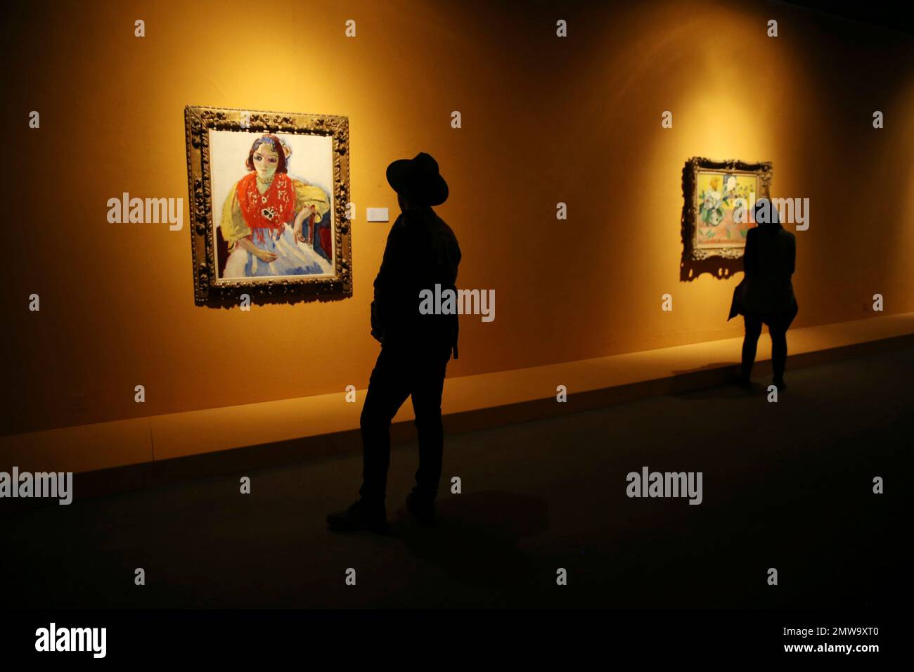 An Iranian man, left, looks at a painting of Kees Van Dongen "Trinidad ...