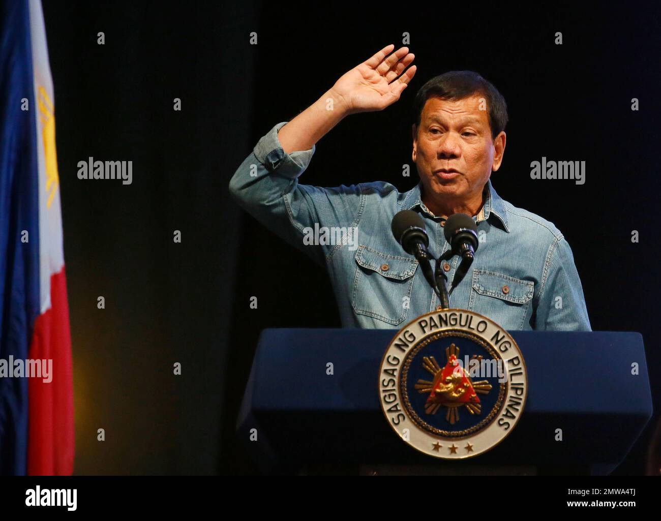 Philippine President Rodrigo Duterte gestures as addresses thousands of ...