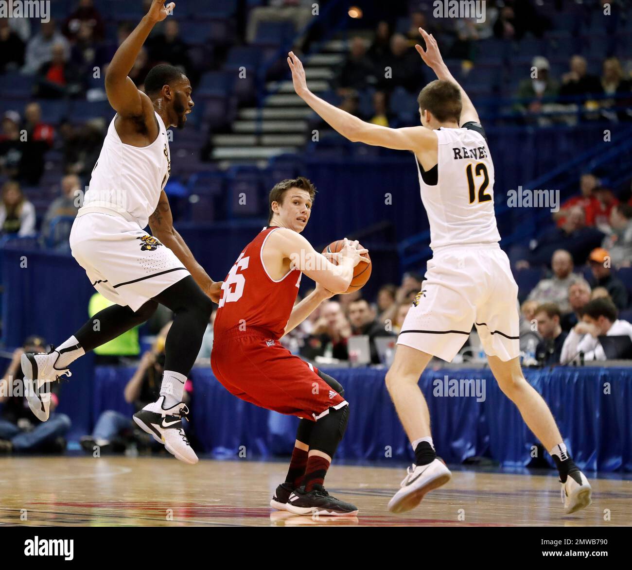 Bradley's Jayden Hodgson, center, looks to pass between Wichita State's ...