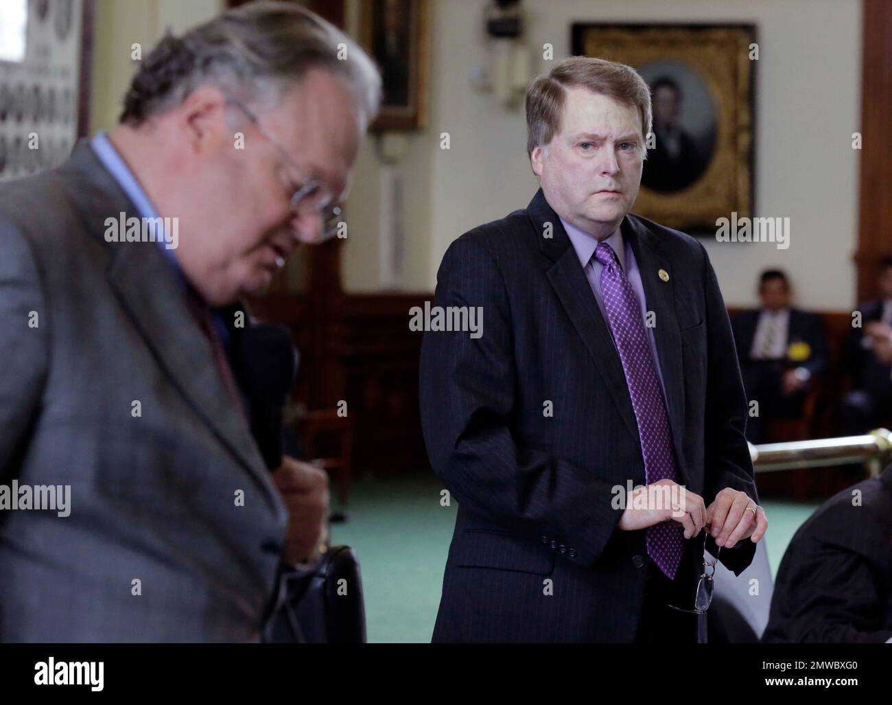 Texas Sen. Brian Birdwell, R-Granbury, right, listens to Sen. Craig ...