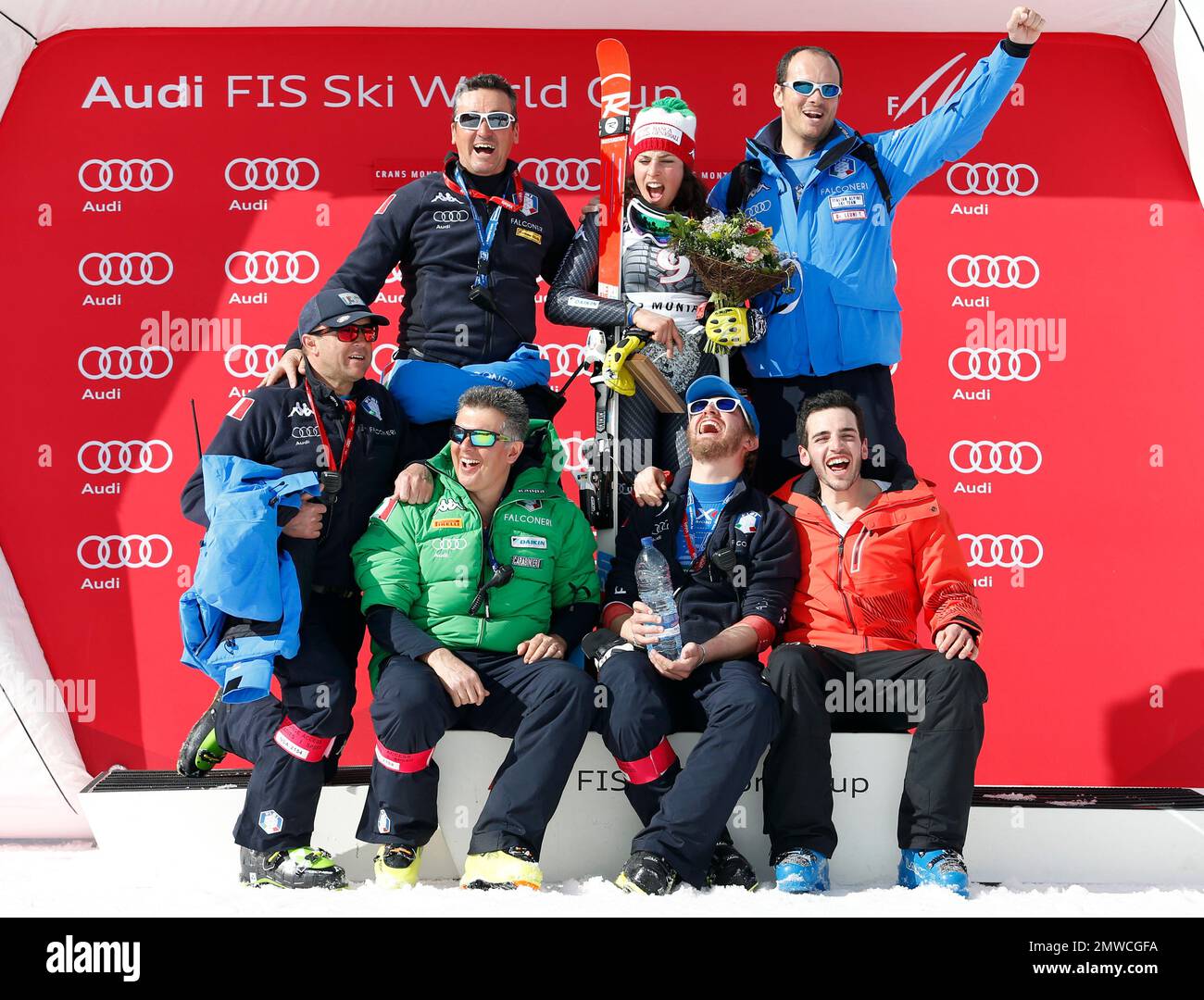 Italy's Federica Brignone, center, celebrates with members of her team ...