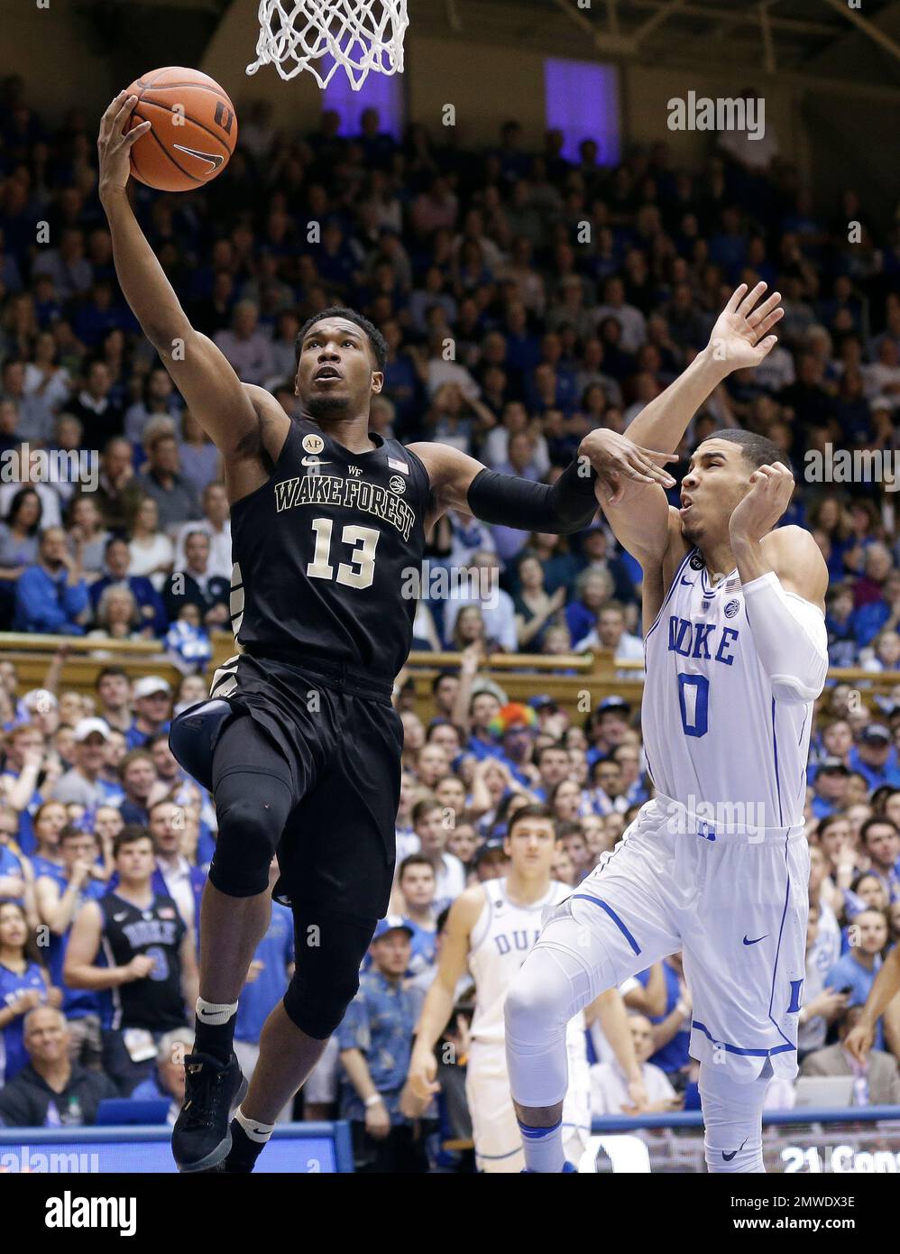 Wake Forest's Bryant Crawford (13) drives to the basket against Duke's ...