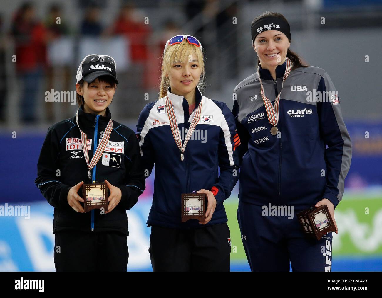 Winner Bo-Reum Kim, center, of South Korea poses with the second placed ...