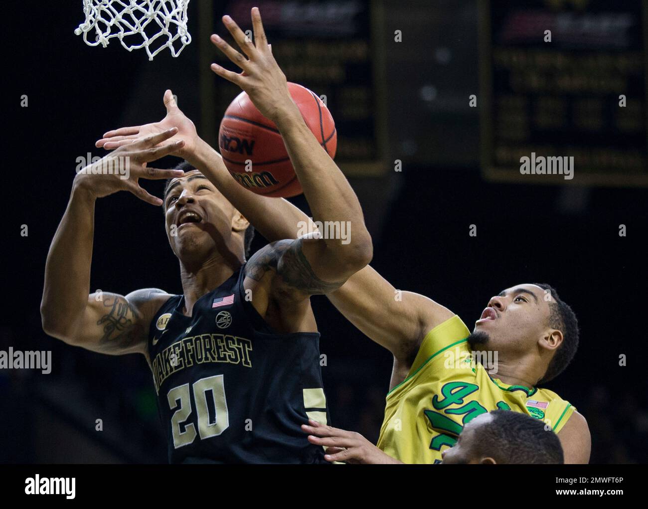 Wake Forest's John Collins (20) competes with Notre Dame's Bonzie ...