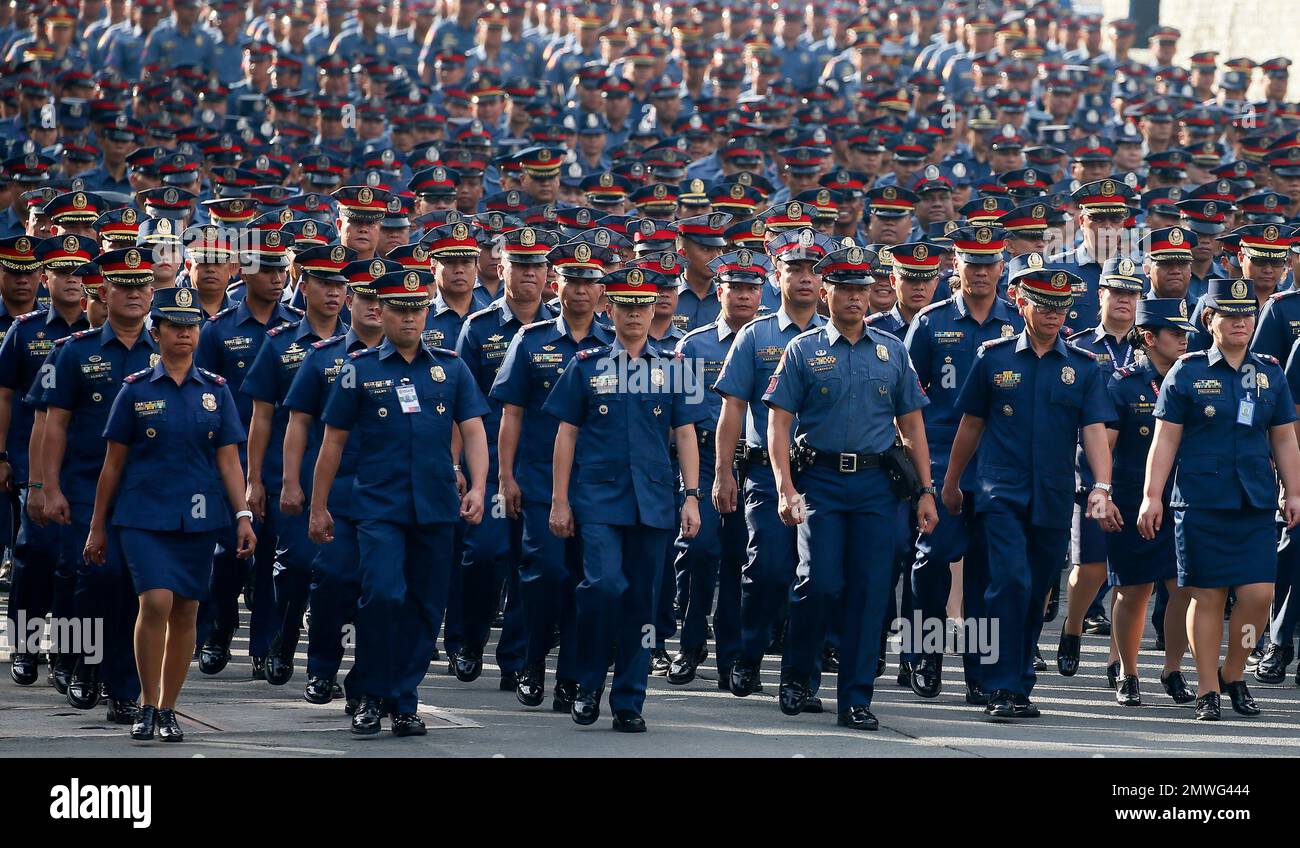 Officers and menbers of the Philippine National Police march past the ...