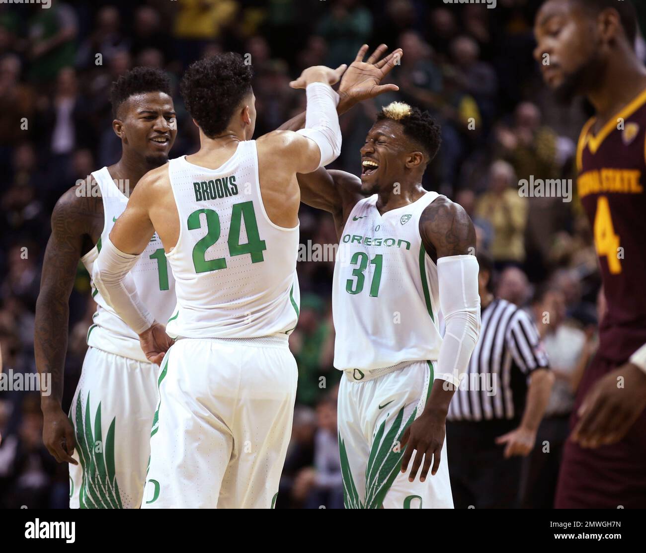 Oregon's Jordan Bell, left, Dillon Brooks and Dylan Ennis celebrate ...