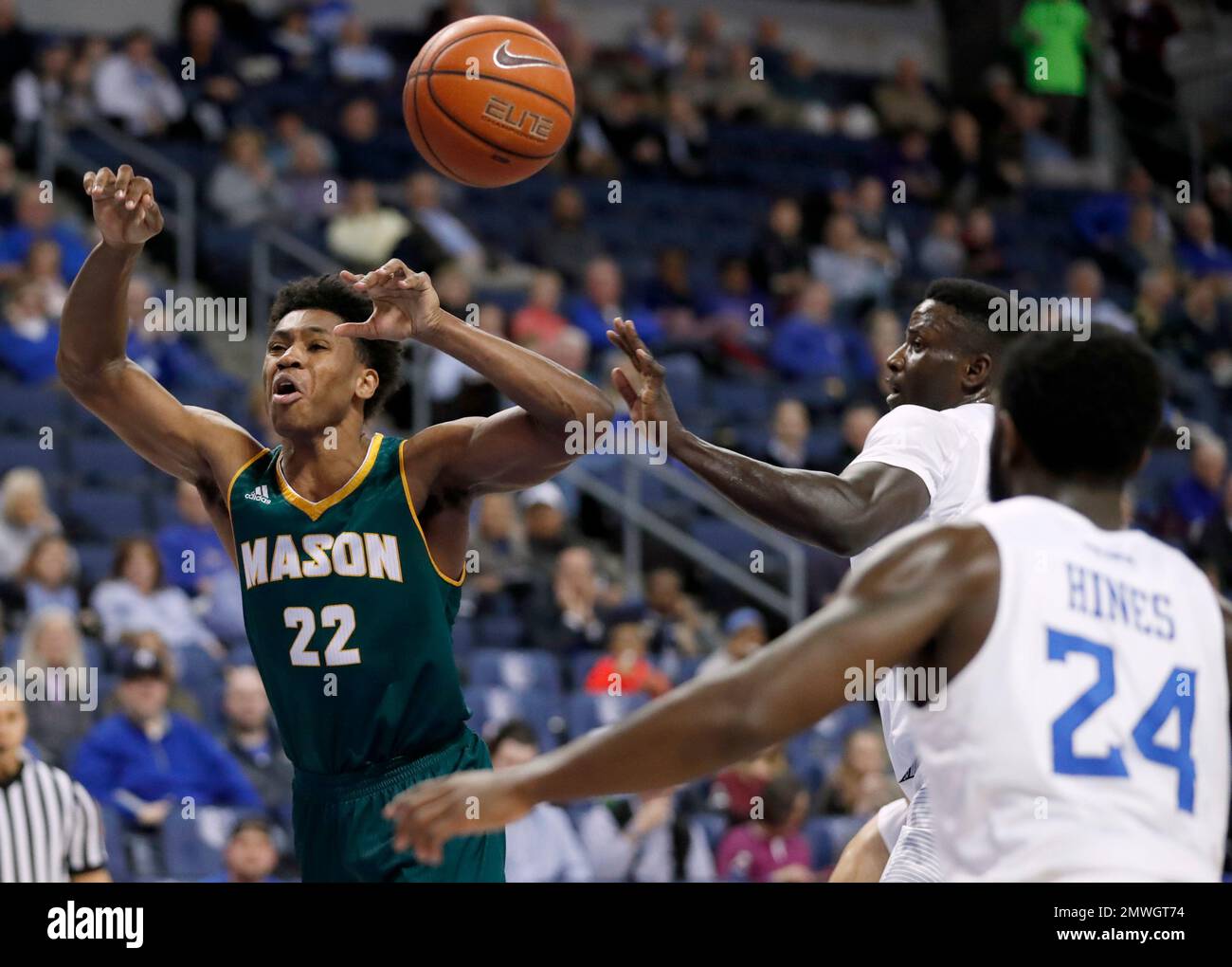 George Mason's Marquise Moore (22) loses control of the ball on the way ...