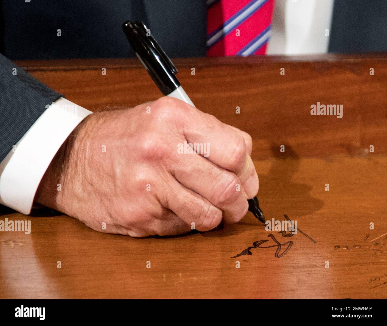 Vice President Joe Biden signs the drawer of the vice president's desk ...
