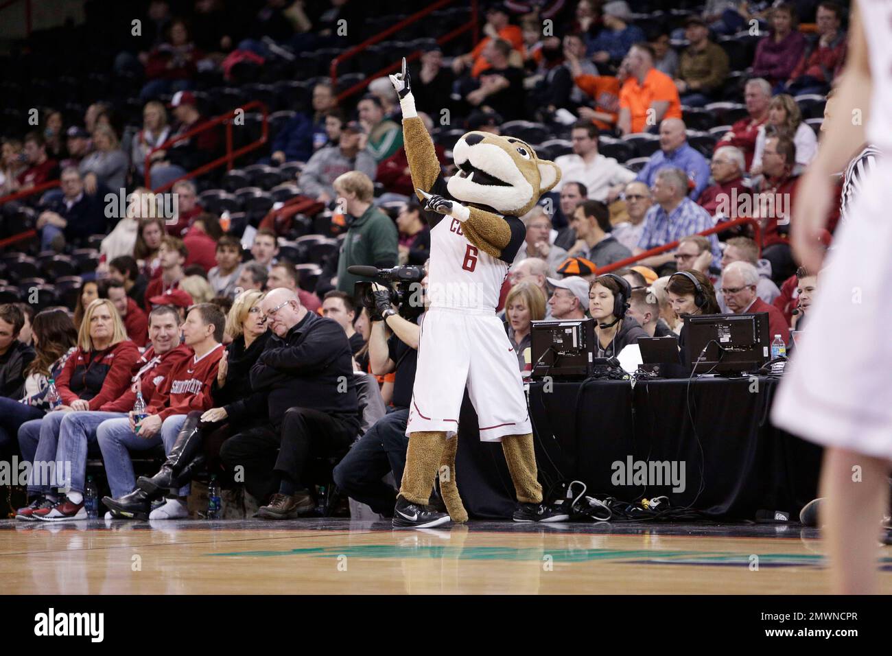 The Washington State mascot leads fans in a cheer during the second ...