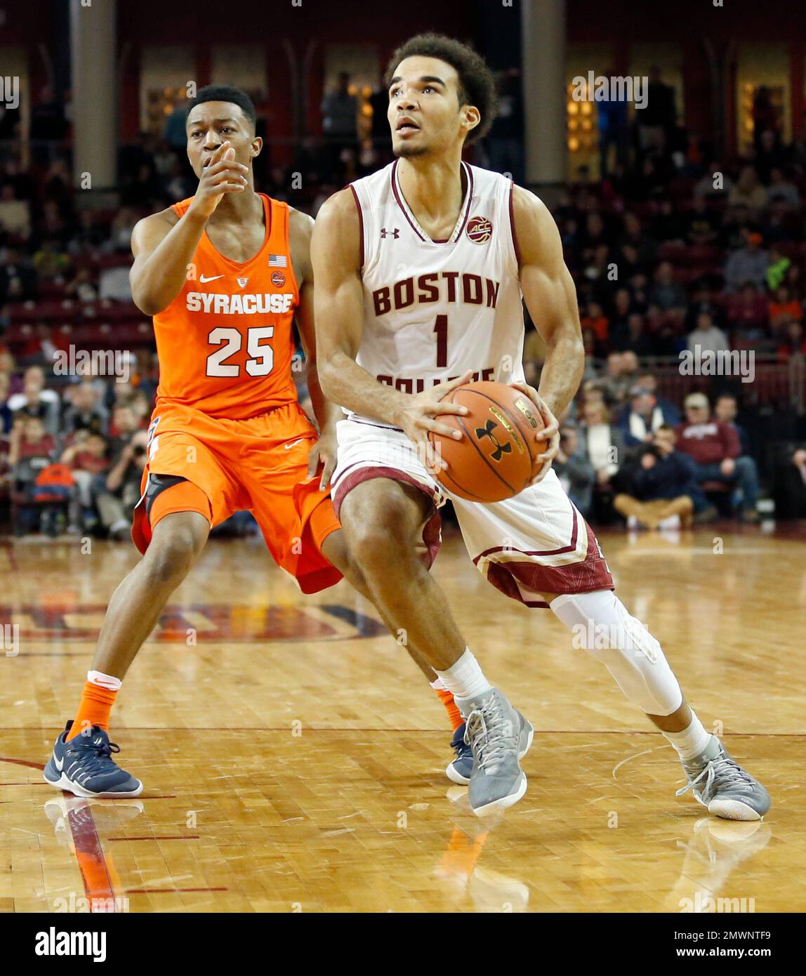 Boston College guard Jerome Robinson (1) drives to the basket ahead of the defense of Syracuse ...