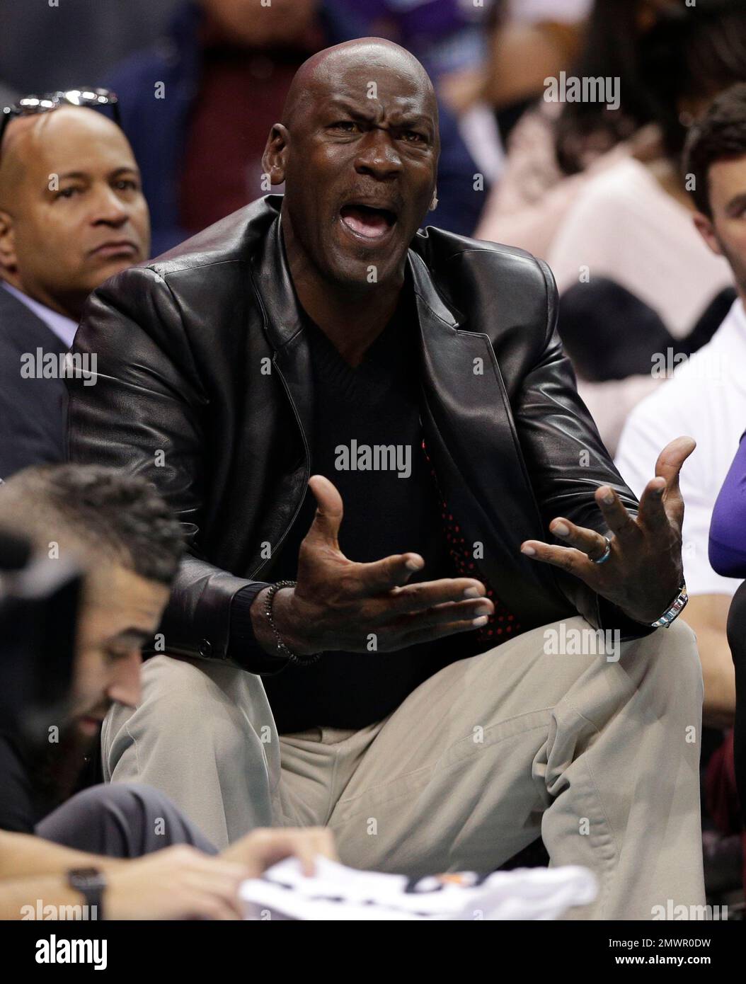 Charlotte Hornets owner Michael Jordan shouts at an official in the ...