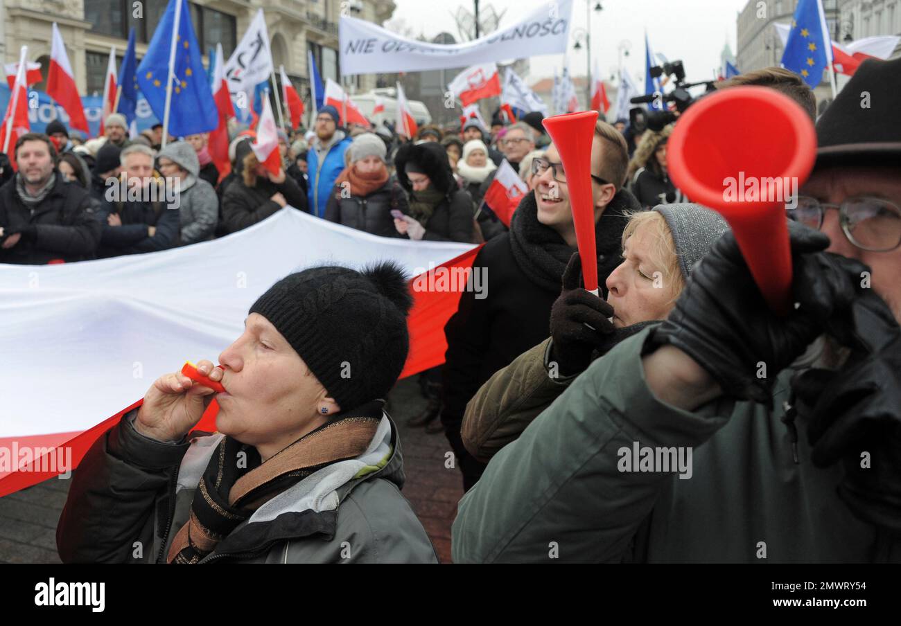 Protesters blow horns and whistles during an anti-government ...