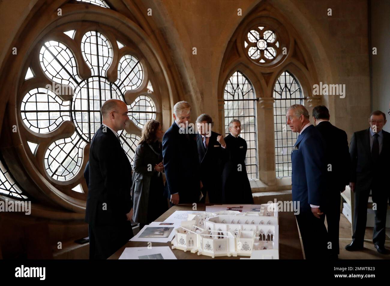 Britain's Prince Charles, third right, is shown a model by exhibition ...