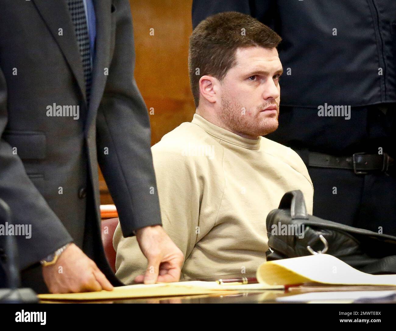 James Rackover listens as his lawyer speaks during his arraignment in ...