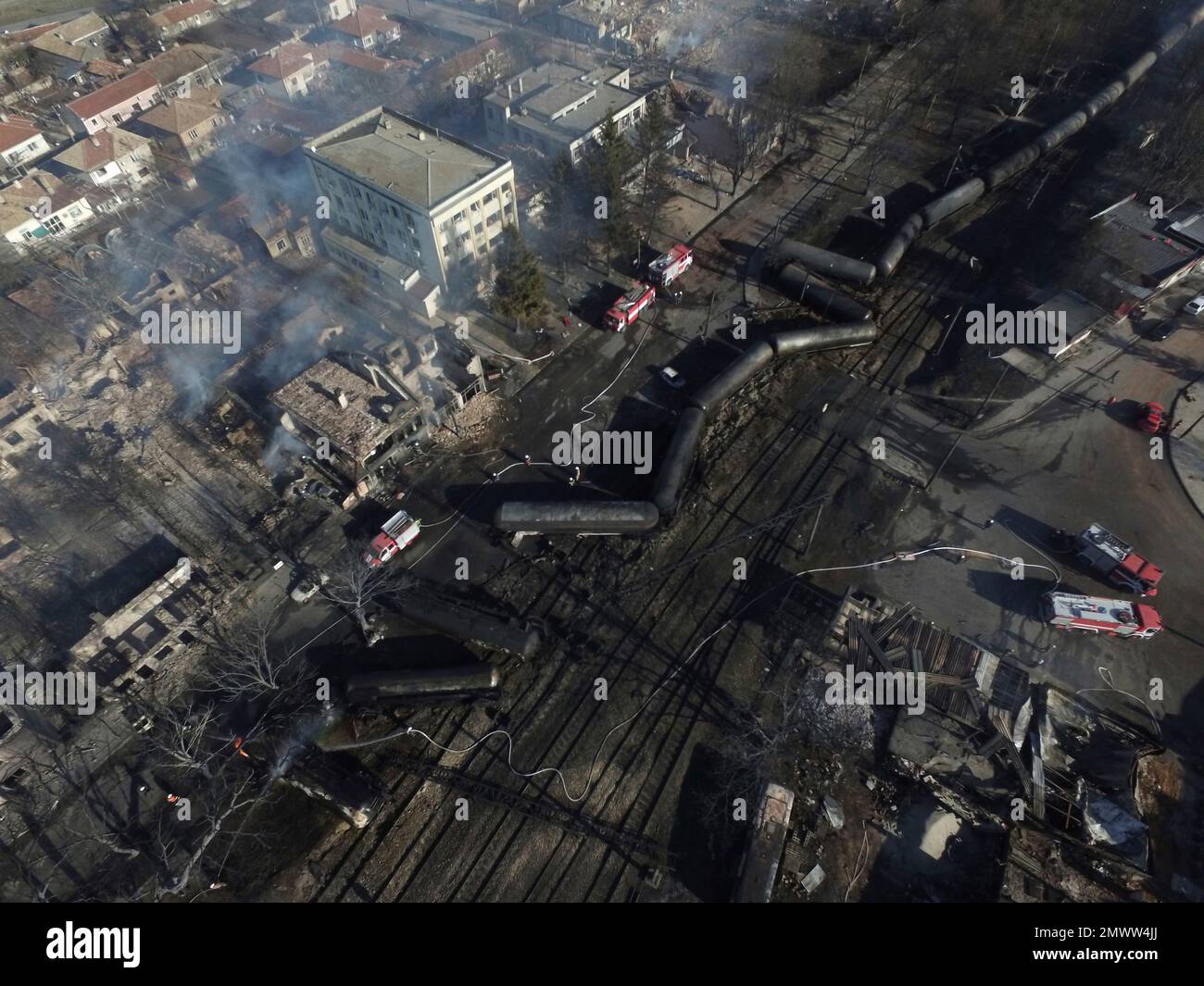 In this aerial view emergency services attend the scene of devastation ...