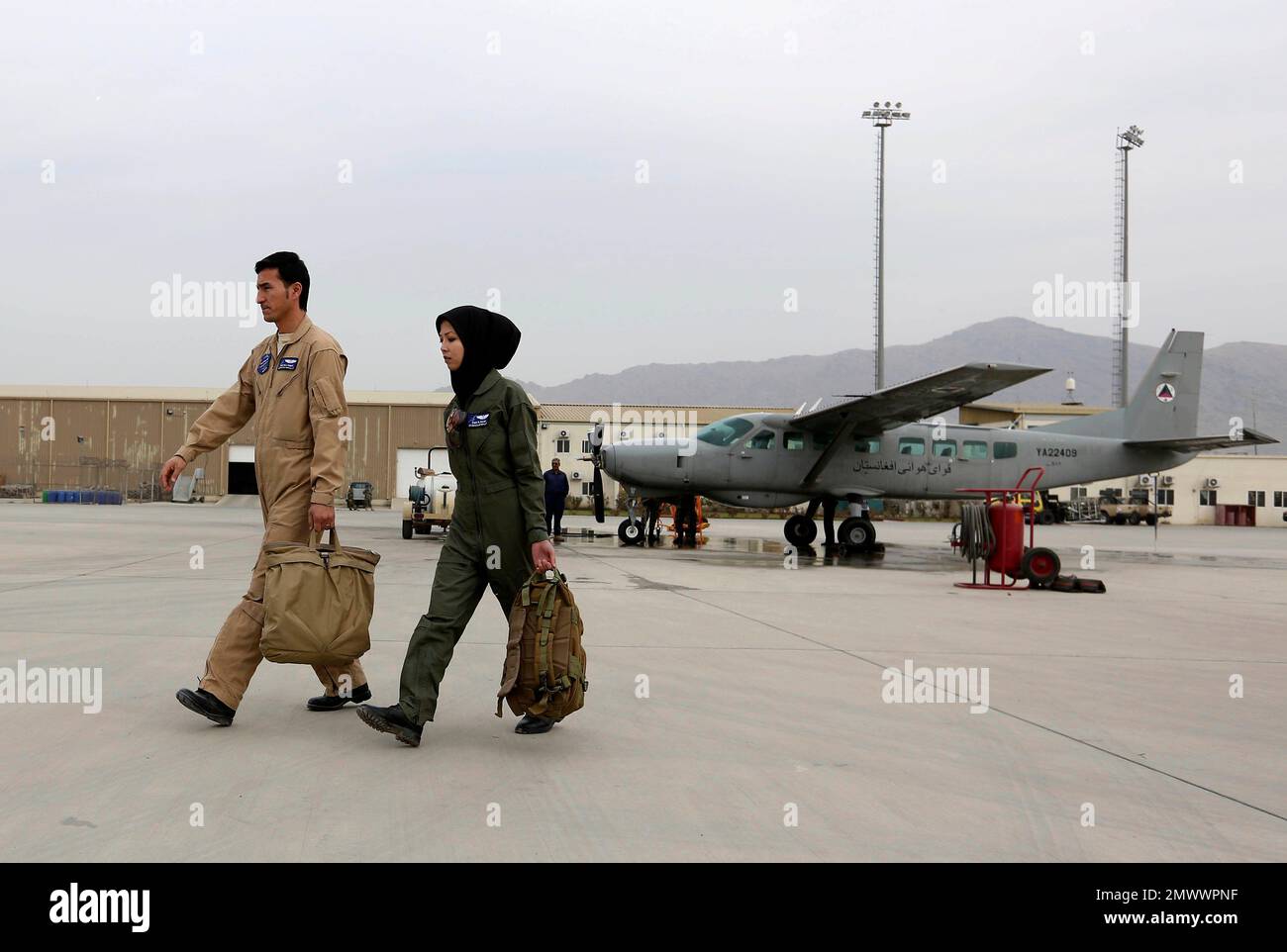 In this Monday, Nov. 21, 2016, photo, Capt. Safia Ferozi, 26, right ...