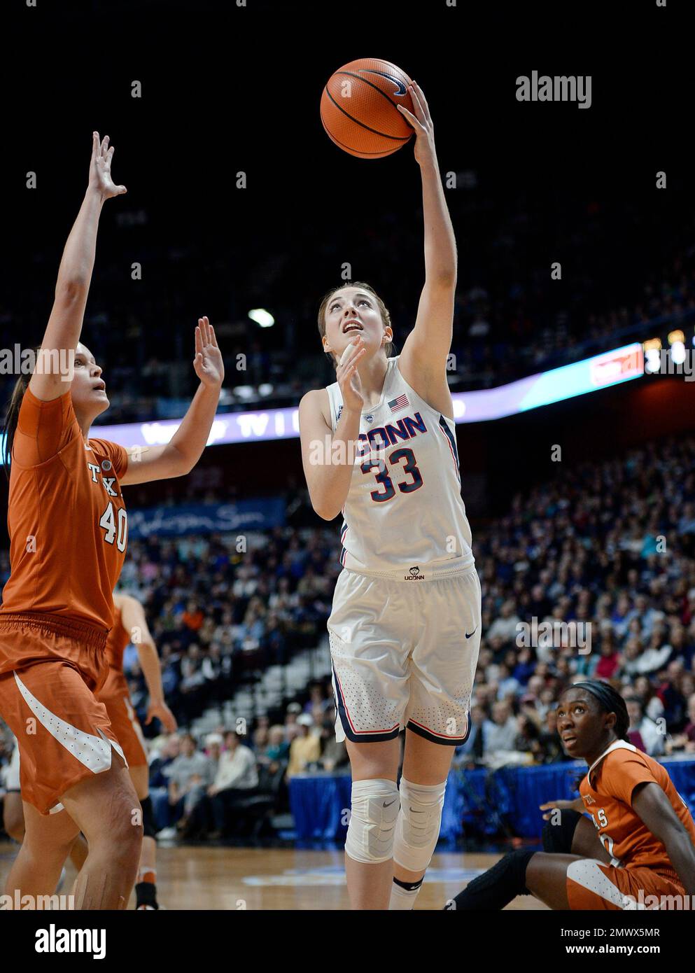 Connecticut’s Katie Lou Samuelson, center, shoots as Texas’ Kelsey Lang ...