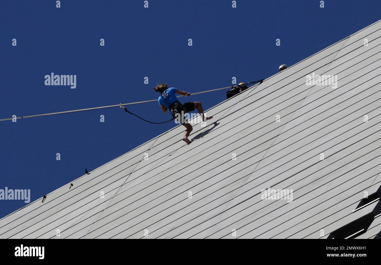 Alexander Schultz, from Germany, hangs on after he lost his balance, as ...