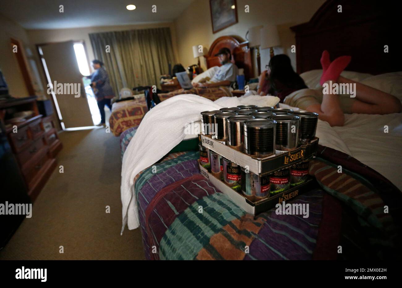 Daniel Howell, a paraplegic, and his daughter Abigail Howell, 11, lie ...