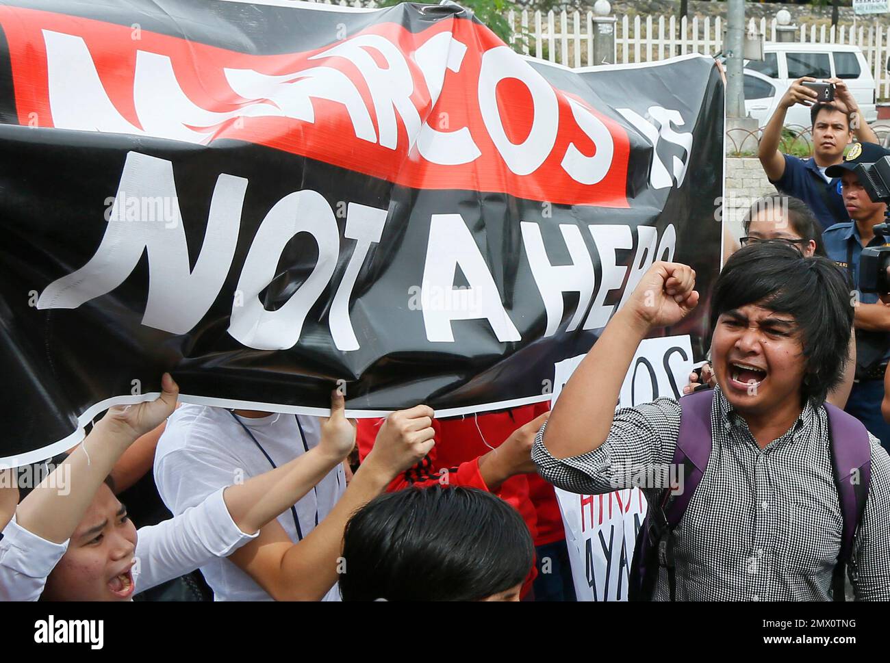 In this Friday, Nov. 18, 2016 photo, protesters chant slogans as the ...