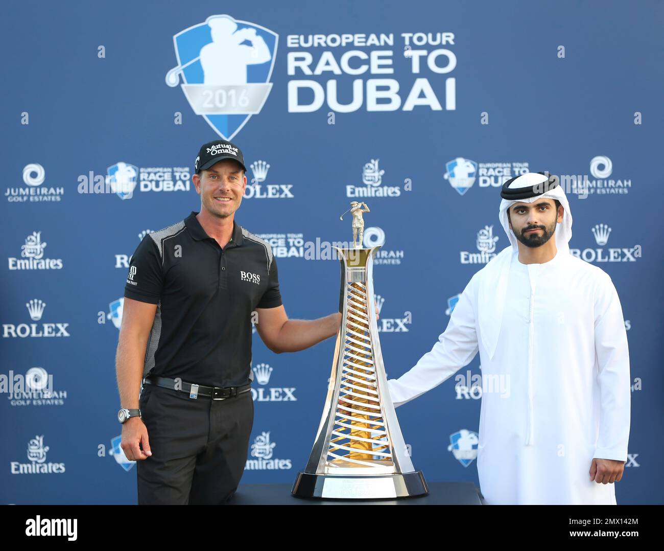 Henrik Stenson of Sweden poses next to Sheikh Mansour bin Mohammed al ...