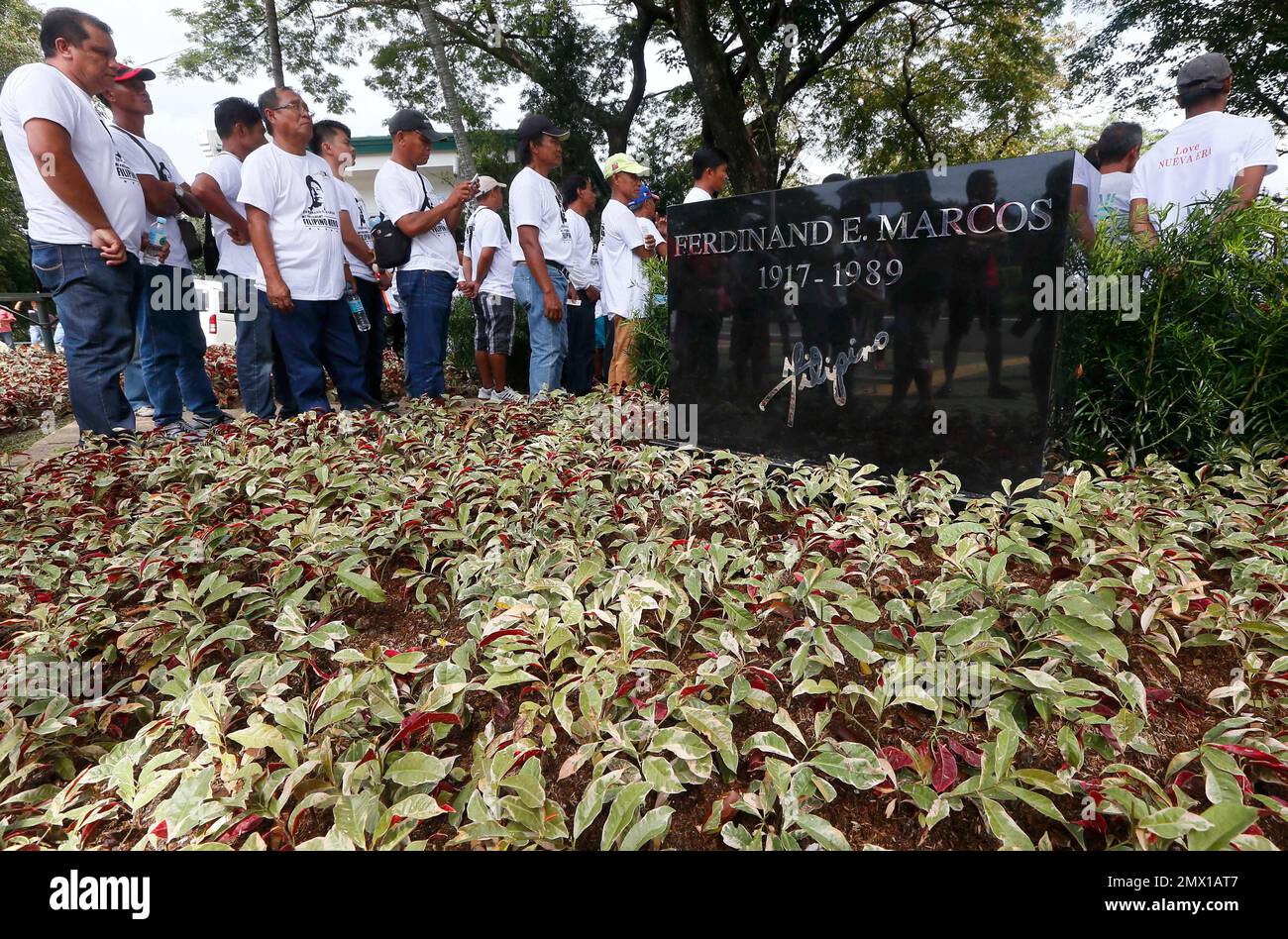 Hundreds of supporters attend a mass at the graveyard of the late ...