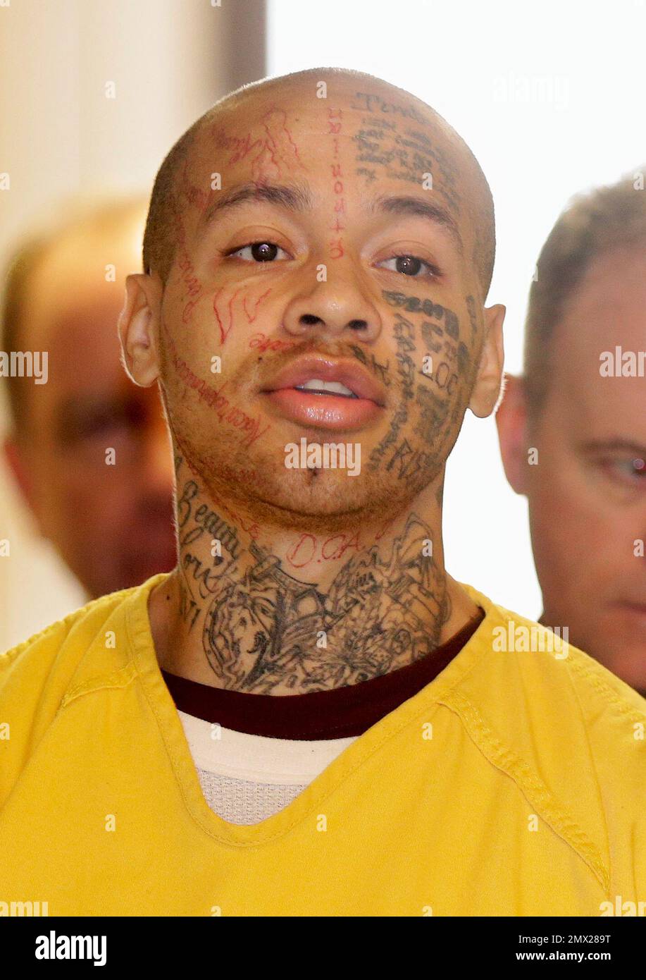 FILE - In this Feb. 12, 2014 file photo, Nikko Jenkins is led by ...