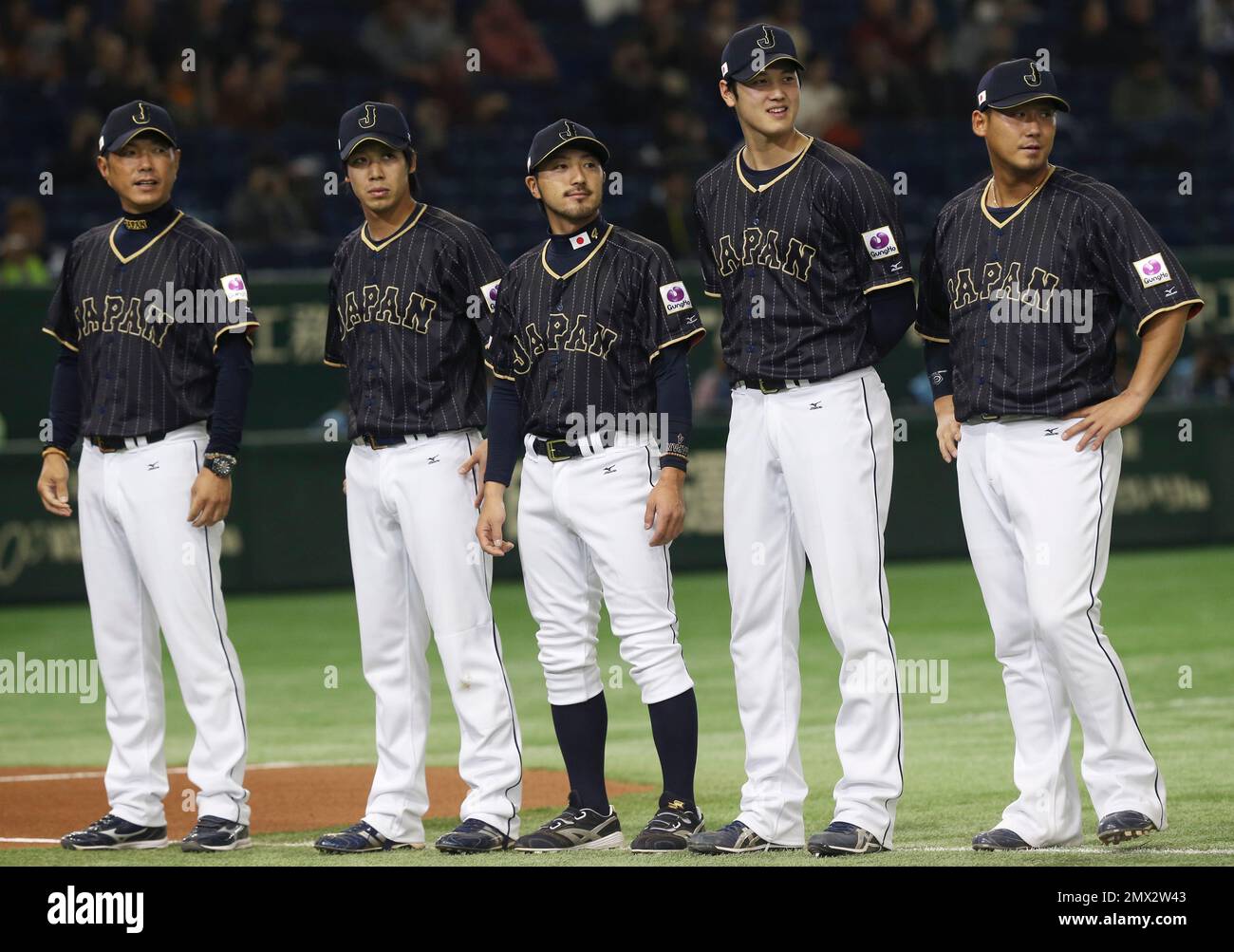Team Japan, from left, manager Hiroki Kokubo, infielder Tetsuto Yamada, infielder Ryosuke ...