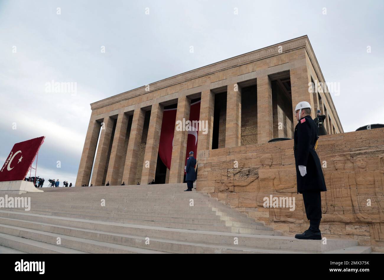 Soldiers salute as thousands of students and citizens walk to his mausoleum to remember the ...