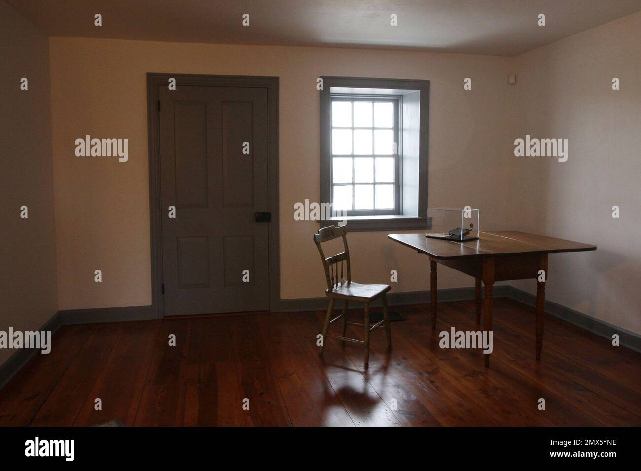 A table and chair rest near a window inside the recently restored Civil ...