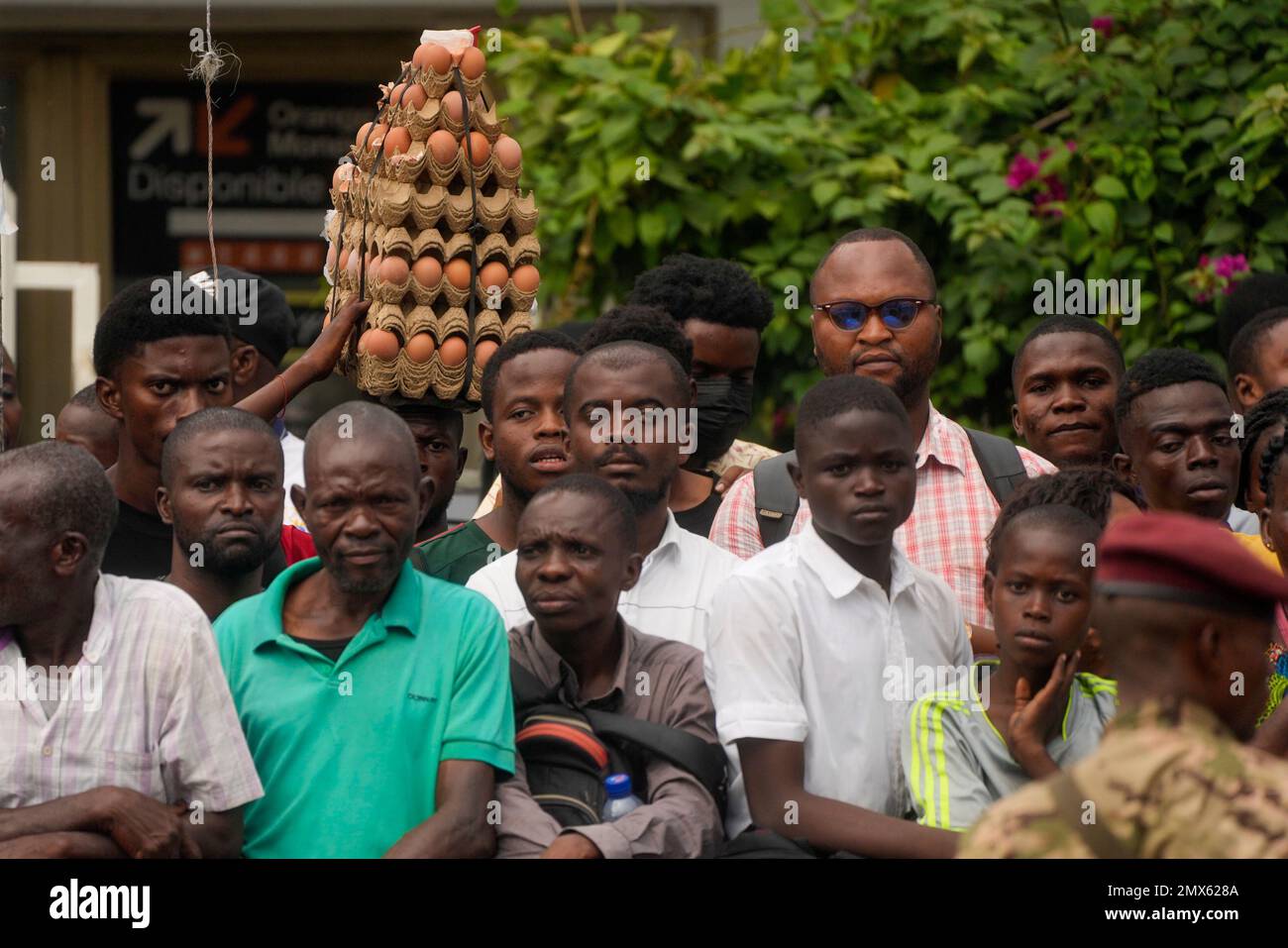 People wait for the arrival of Pope Francis for a meeting with priests ...