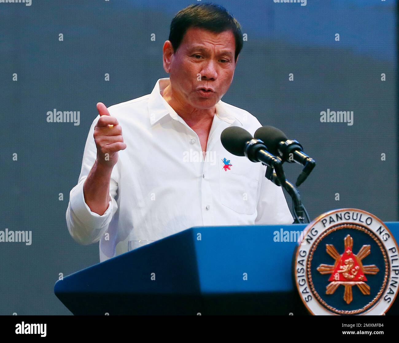 Philippine President Rodrigo Duterte gestures during his address to a ...
