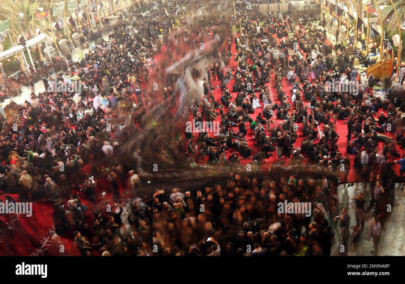 Shiite worshippers gather inside the shrine of Imam Hussein during ...