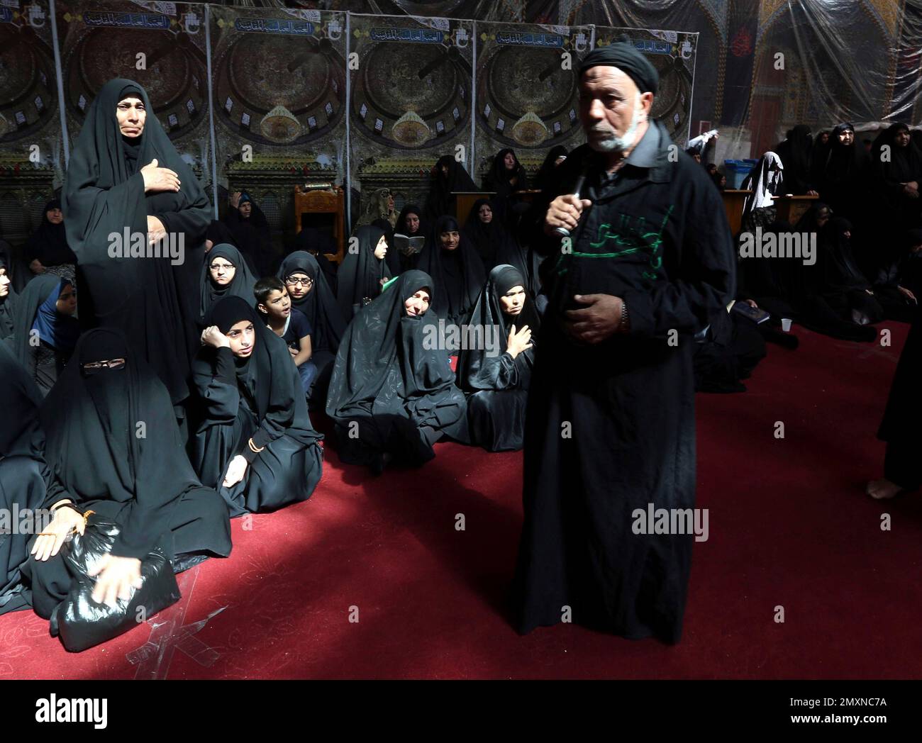 Shiite worshippers gather inside the shrine of Imam Abbas during ...