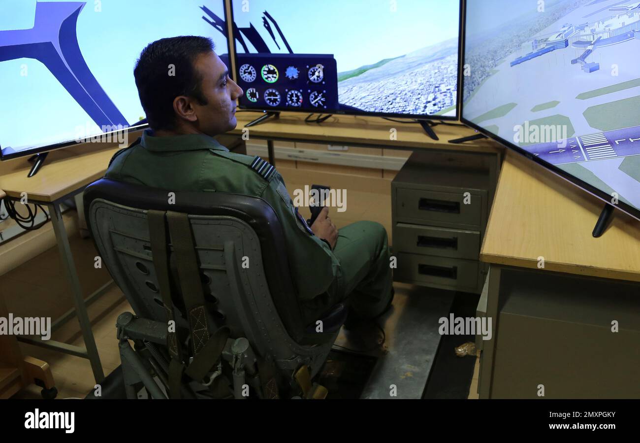 An Indian Air Force (IAF) personnel handles a flight simulator at an ...