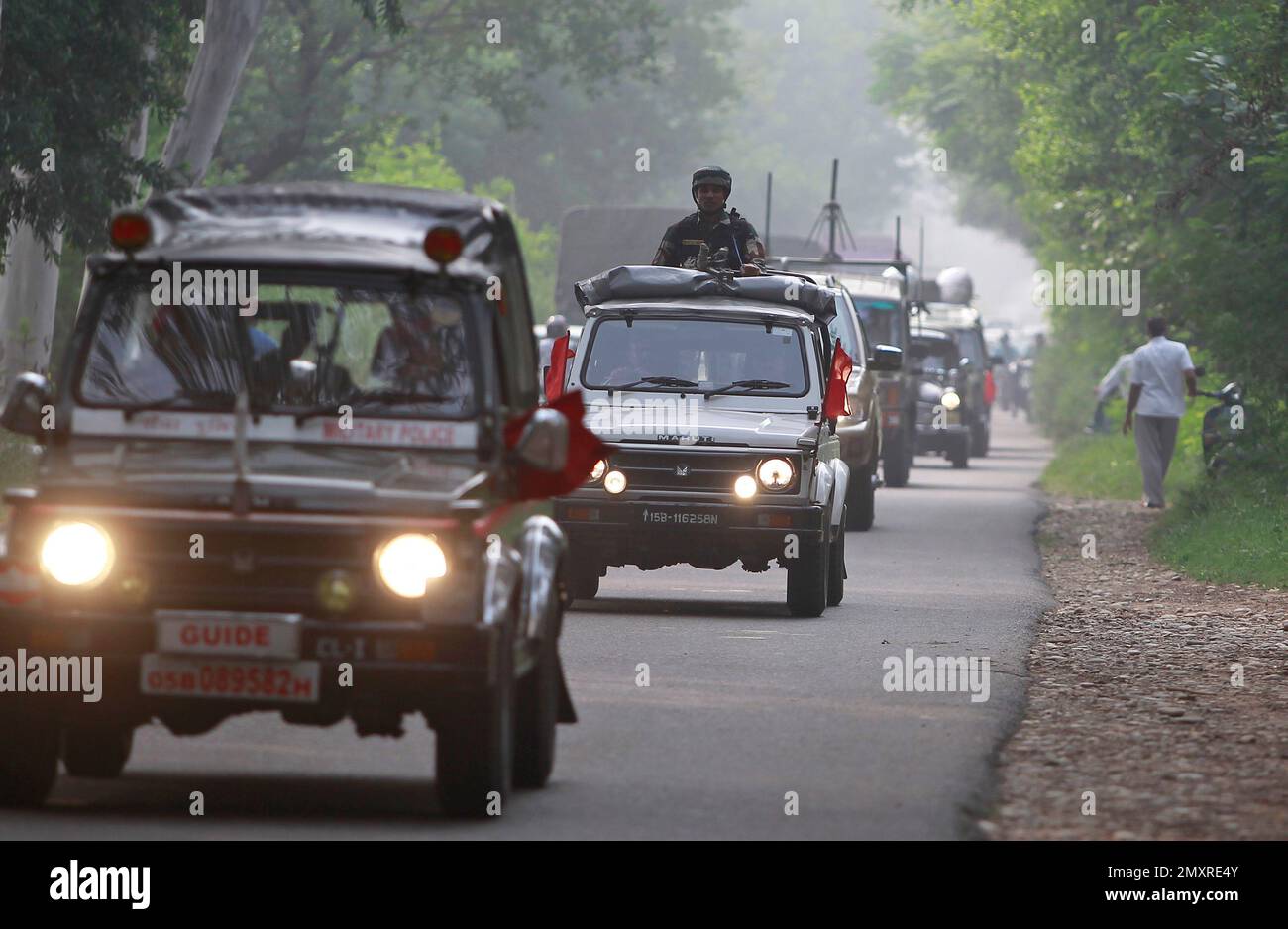 An Indian army convoy moves near the highly militarized Line of Control ...