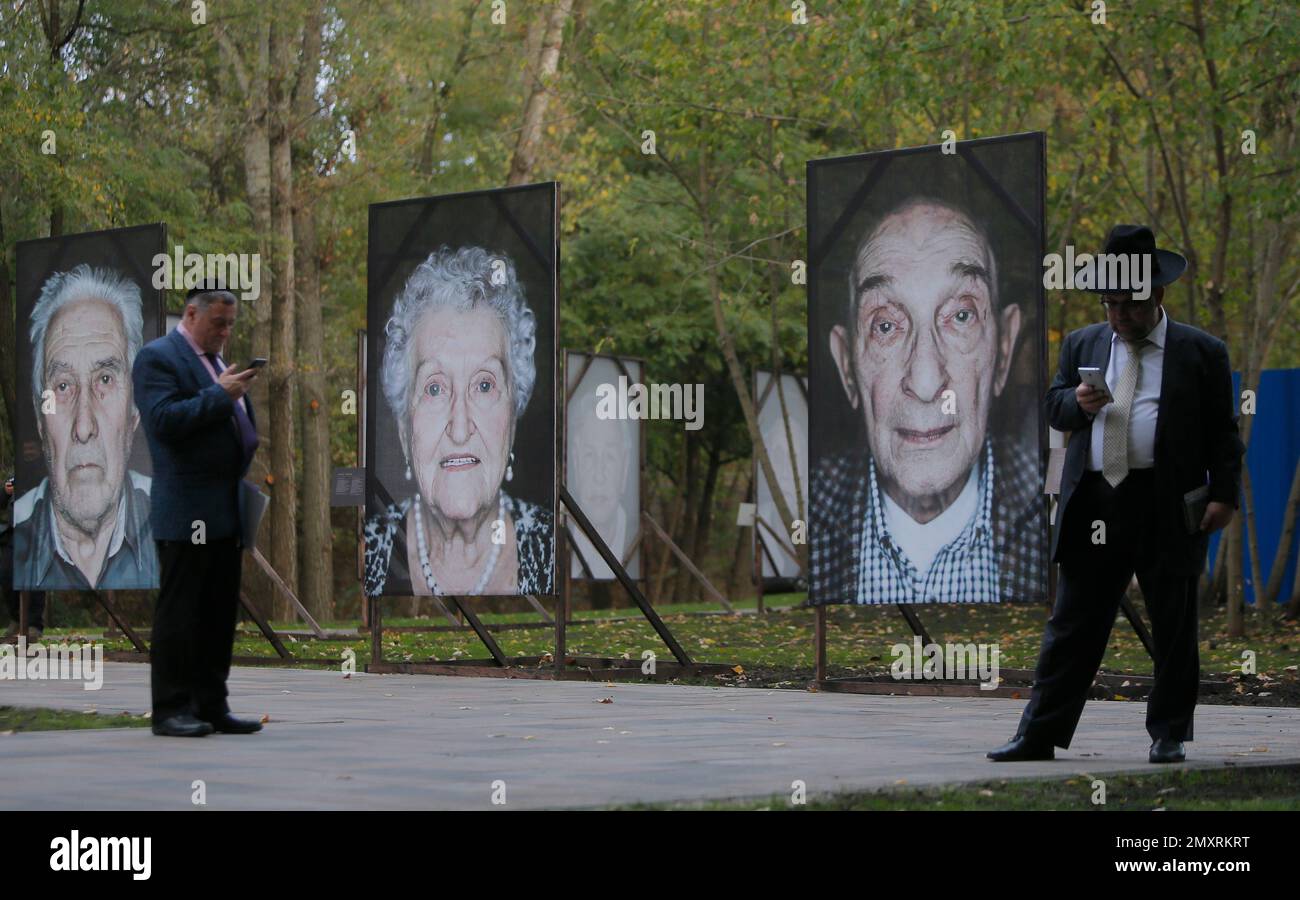 Jews pray reading sacred texts through cell phones standing near ...