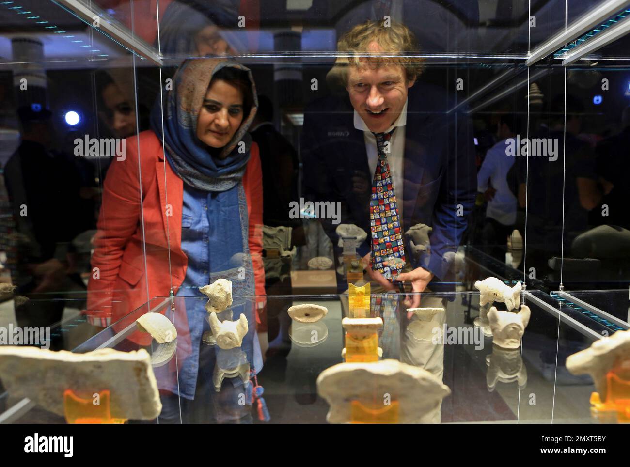 An invited guest from British Museum, right, and an official from Iraq ...
