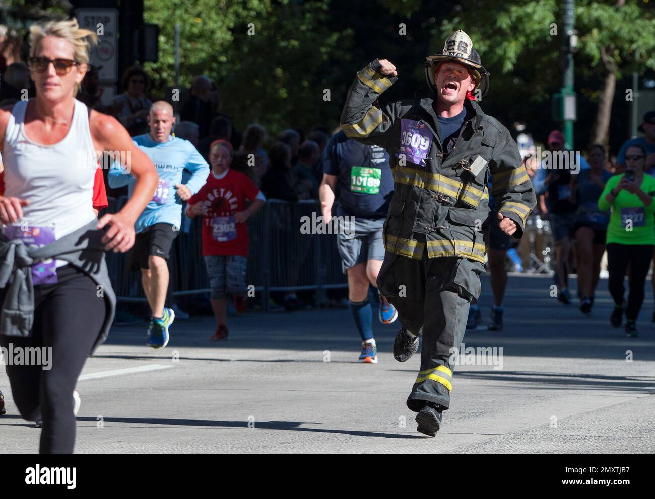 Participants near the finish line during the "Stephen Siller Tunnel to ...